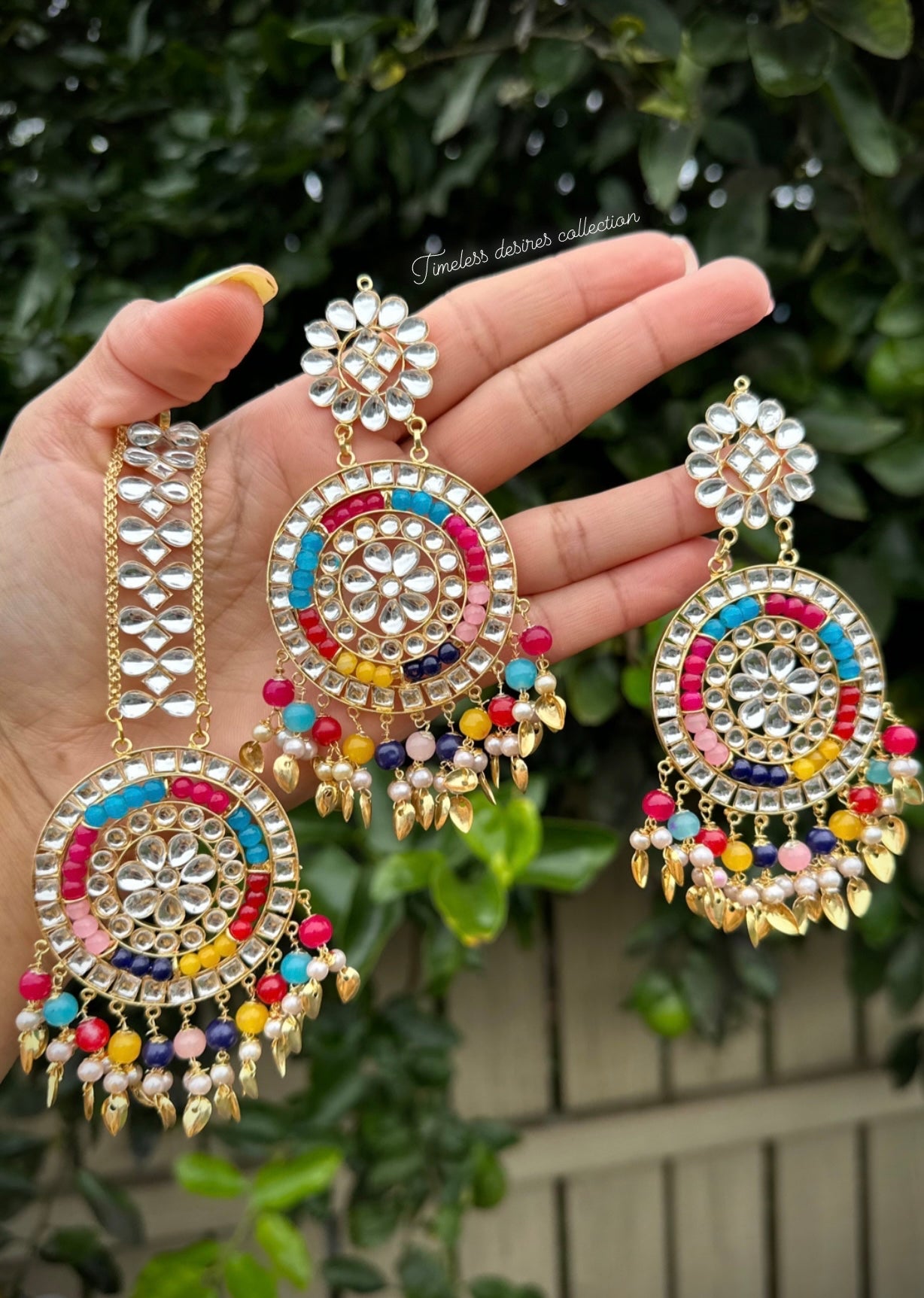 Multi coloured earrings and tikka set with pipal Patti in traditional ...